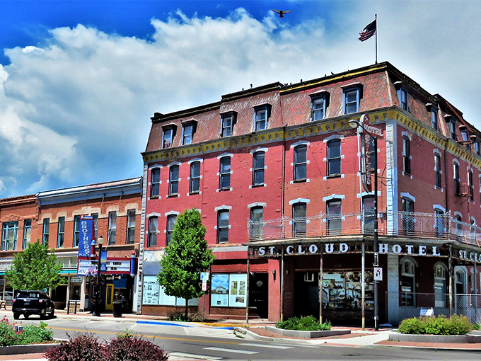 Historic brick buildings line Main Street in Ca&ntilde;on City, where Pizza Madness offers a slice of local flavor amid architecture that whispers tales of Colorado's past. 