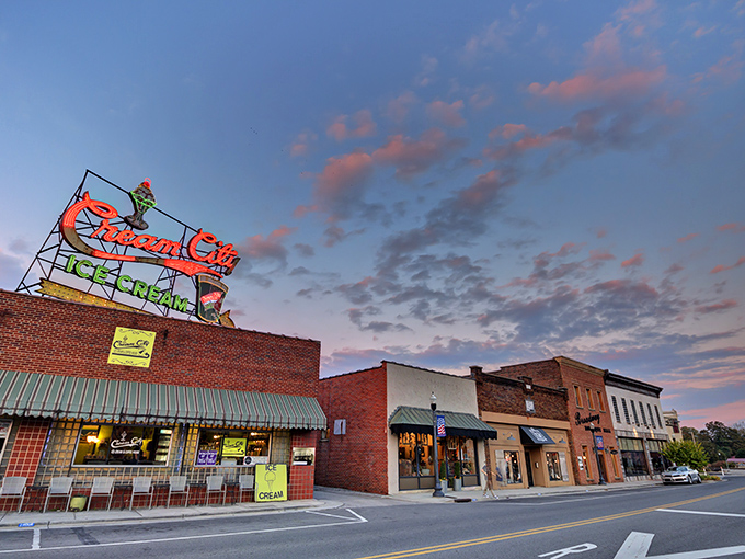 Historic storefronts with classic blue awnings create that perfect small-town ambiance where your dollar stretches further than your weekend plans.