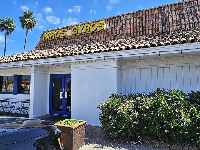 The humble exterior of Niro's Gyros stands like a Mediterranean mirage in the Phoenix desert, complete with classic tile roof and swaying palm trees.