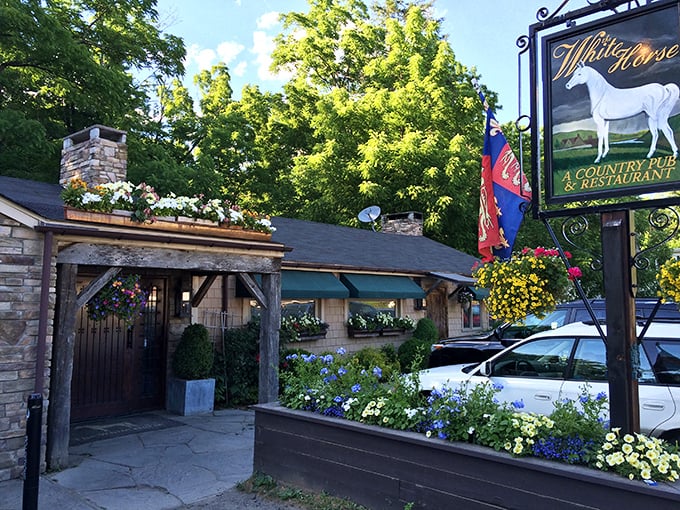 A rustic stone and timber haven nestled among Connecticut's autumn foliage, The White Horse looks like it was teleported straight from the Cotswolds.