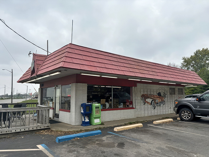 The classic red-roofed exterior of Rock-Cola 50's Cafe promises a time warp before you even step inside. That vintage Corvette mural isn't just decoration&mdash;it's a preview of coming attractions.