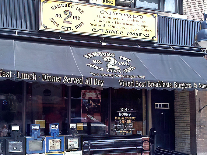 The iconic awning of Hamburg Inn No. 2 beckons like a breakfast lighthouse on Linn Street, promising pieshakes and happiness since 1948.