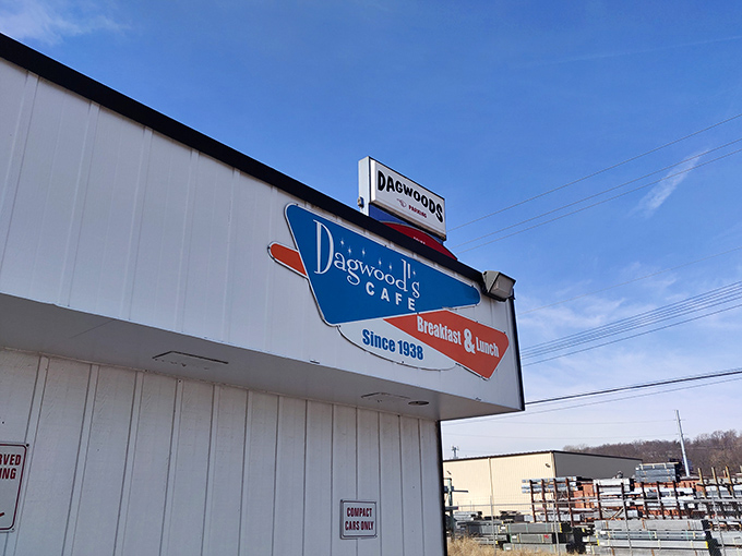 The unassuming white exterior of Dagwood's Cafe stands like a breakfast beacon against the Kansas sky, promising morning magic since 1938.