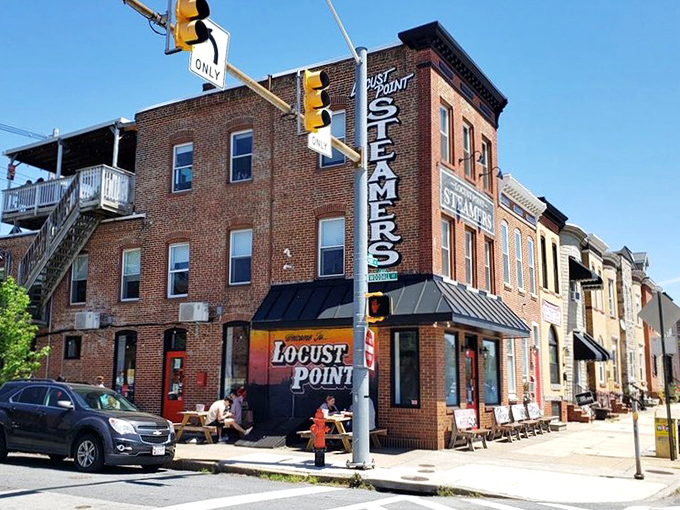 The corner brick building with its vertical "STEAMERS" sign stands like a lighthouse for seafood lovers navigating Baltimore's Locust Point neighborhood.