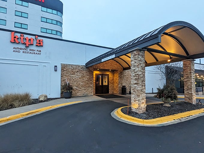 The welcoming stone entrance of Kip's Irish Pub stands ready to rescue you from Minnesota winters with its promise of warmth and hearty fare inside.