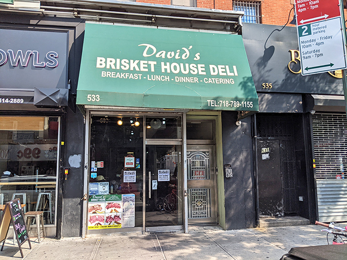 A beacon of brisket brilliance! David's Brisket House stands proud, its green awning a siren call to sandwich lovers everywhere.