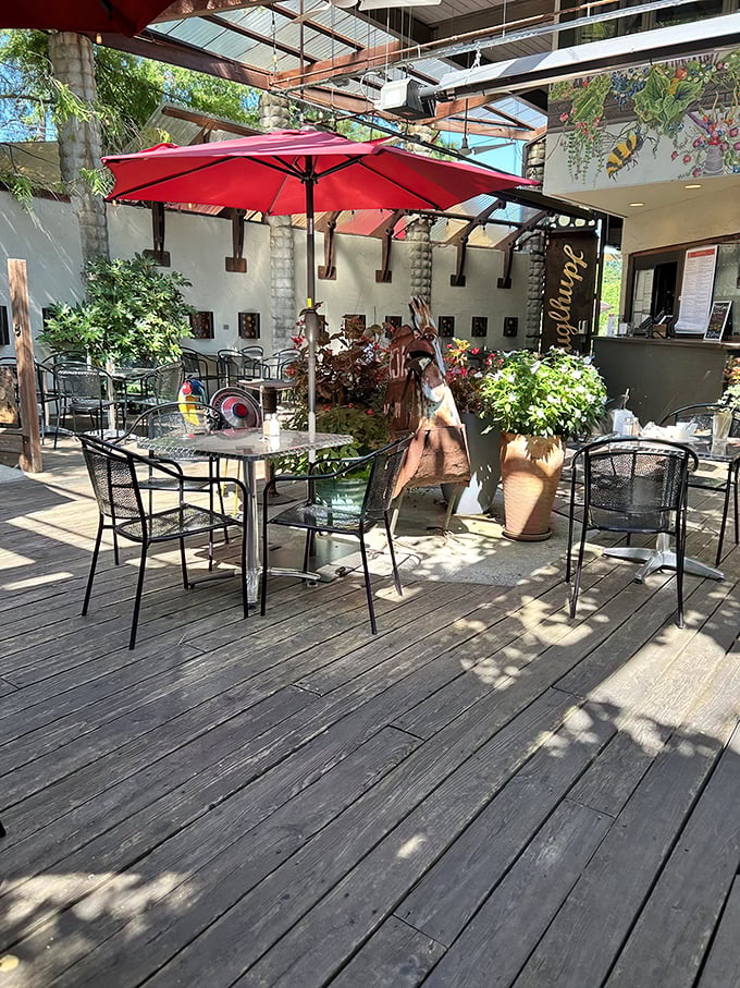 A slice of Bavaria in Durham! This charming outdoor patio is where lederhosen meets Southern hospitality, complete with red umbrellas that pop like cherry tomatoes in a garden salad.