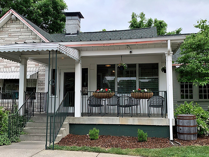 The humble stone facade of Loveless Cafe stands like a time capsule of Southern hospitality, promising comfort food treasures within its welcoming porch.