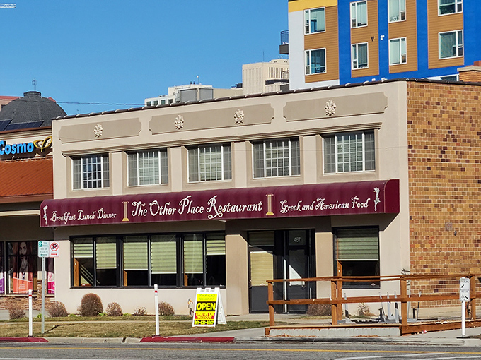 The unassuming exterior of The Other Place Restaurant proves that culinary treasures often hide behind modest facades. Greek greatness awaits inside!