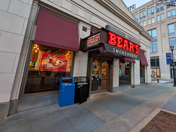 The stone facade of Bear's Smokehouse stands like a temple to barbecue, its bold red sign a beacon to hungry pilgrims seeking smoky salvation.
