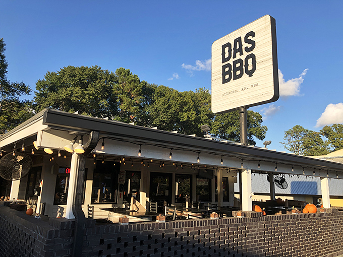 That classic barbecue joint exterior promises serious smoky business happening inside those welcoming doors.