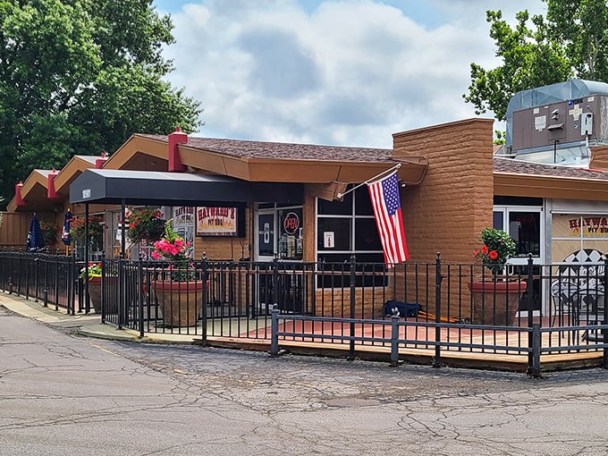 The American flag waves proudly outside Hayward's, as if to say, "The pursuit of happiness includes perfectly smoked ribs." Classic Kansas BBQ patriotism at its finest.