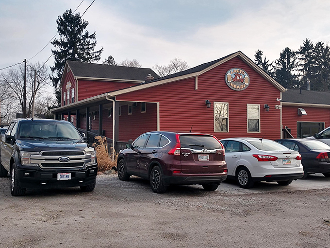The red farmhouse beckons like a BBQ lighthouse on the Ohio horizon. Flower beds and rustic charm promise smoky delights within.