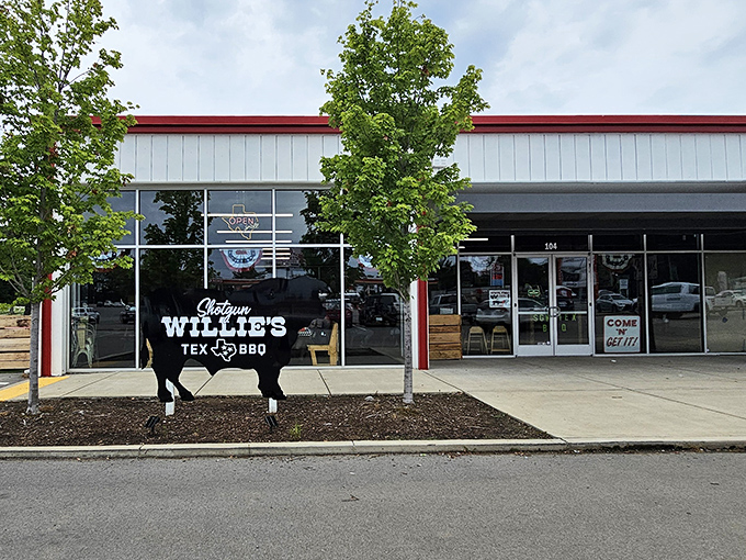 The iconic black cow sign stands guard outside this unassuming strip mall location, promising Texas-sized flavor inside.