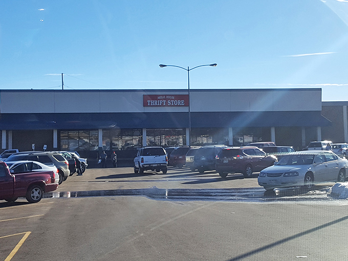 The blue awning of Mile High Thrift beckons like a bargain-hunter's lighthouse, guiding thrifty souls to shores of unexpected treasures.
