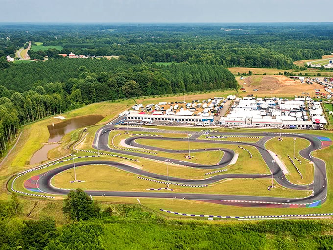 The sprawling track stretches before you like a ribbon of possibility, where everyday drivers transform into racing legends for an afternoon.