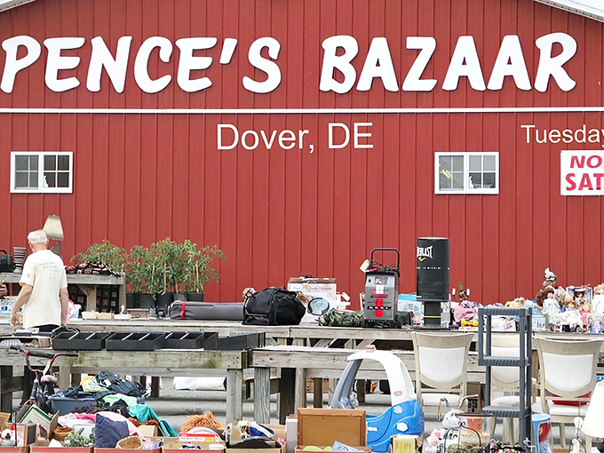 The iconic red barn of Spence's Bazaar stands like a treasure chest waiting to be opened, promising adventures in bargain hunting under the Delaware sky.