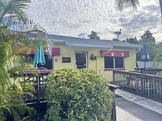 The cheerful yellow exterior with pink awnings isn't just inviting&mdash;it's practically shouting "breakfast is served!" Palm trees and a wooden deck complete this slice of Florida comfort.