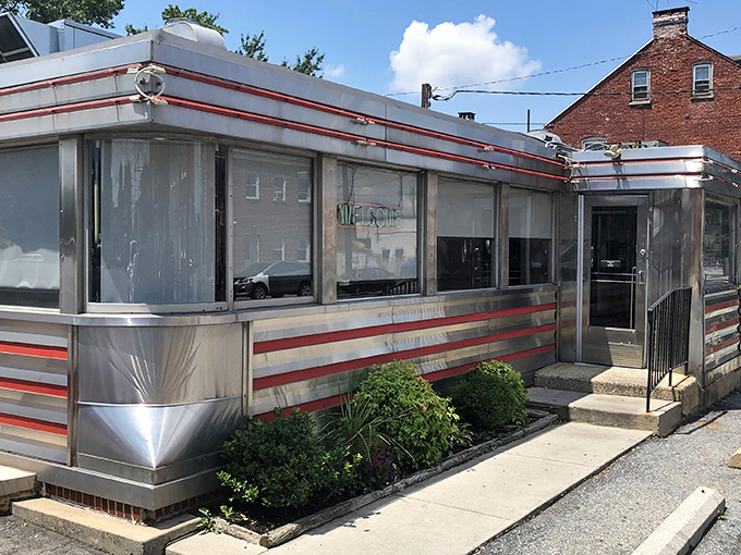Neptune Diner's gleaming stainless steel exterior with classic red trim isn't just nostalgic&mdash;it's a time machine disguised as a restaurant. Comfort awaits inside. 