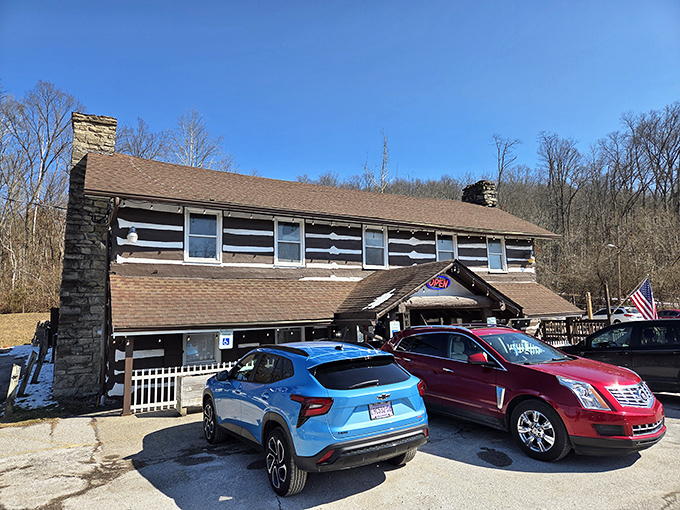 The iconic Log Cabin Inn exterior showcases authentic cabin architecture with its distinctive brown and white pattern&mdash;Kentucky comfort food headquarters in architectural form. 