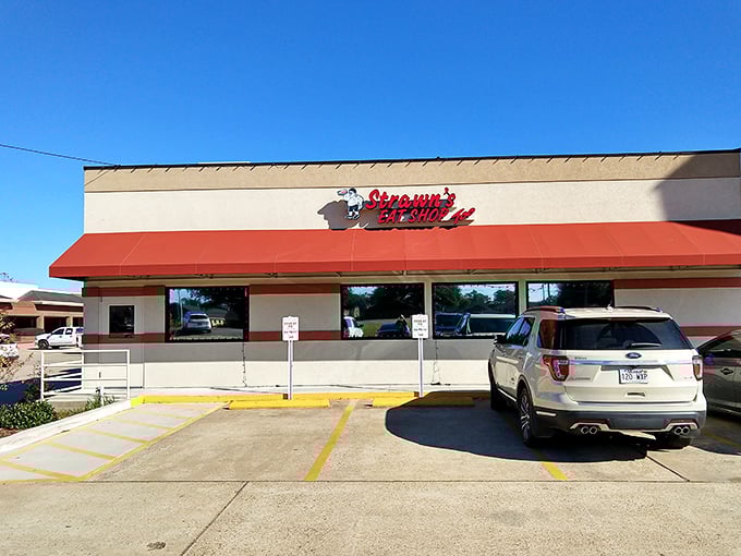 The exterior of Strawn's Eat Shop Too stands proudly against the Louisiana sky, a beacon of comfort food that's been calling hungry diners home for generations. 