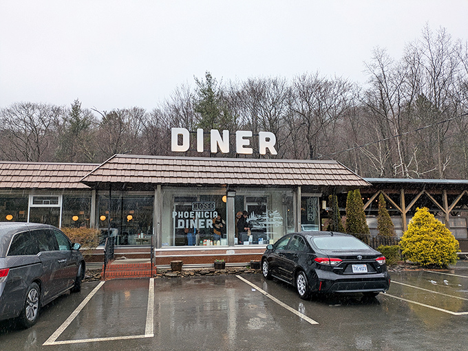 The unassuming roadside exterior belies the culinary treasures within. Those white "DINER" letters on the roof are like a beacon for hungry travelers in the Catskills.