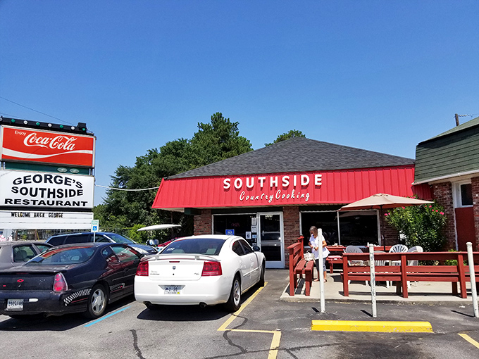 The bright red awning of George's Southside beckons hungry travelers like a culinary lighthouse on Charleston Highway, promising comfort food salvation inside.