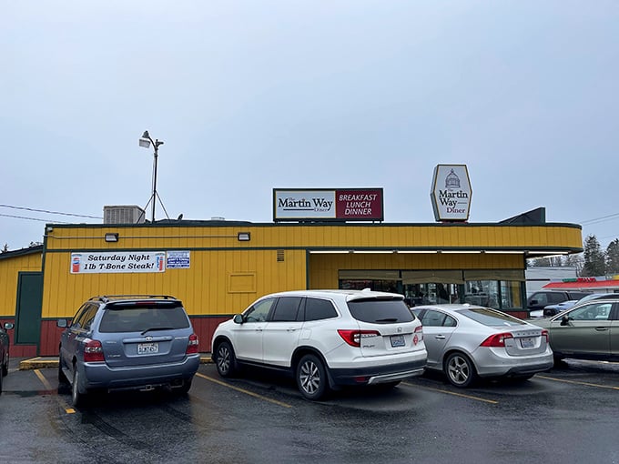 The sunshine-yellow exterior of Martin Way Diner stands out like a beacon of hope for hungry travelers. No fancy architecture needed when what's inside matters most.