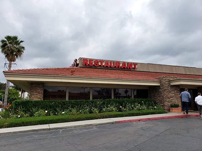 The unassuming stone facade of Keno's Restaurant stands like a culinary fortress, promising comfort food treasures within its humble walls.