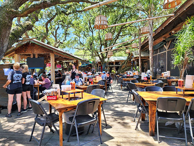 The weathered exterior of The Crab Shack stands as a beacon of seafood authenticity on Tybee Island. No fancy facades needed when what's inside is this good.