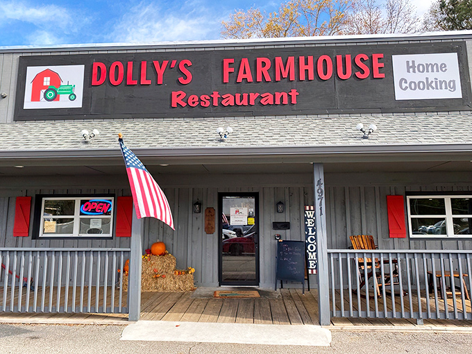 The rustic wooden exterior of Dolly's Farmhouse Restaurant promises authenticity before you even step inside. That American flag isn't just decoration—it's a guarantee.