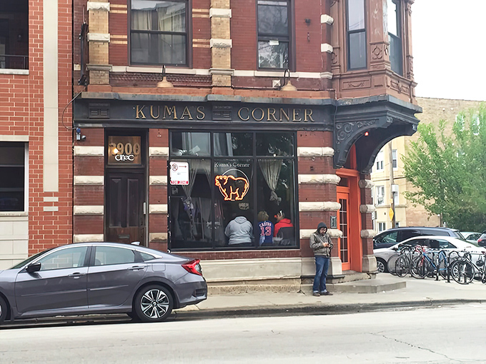 Kuma's Corner stands proudly at Belmont Avenue, its vintage brick exterior and metal band logos promising a burger experience that's anything but ordinary.