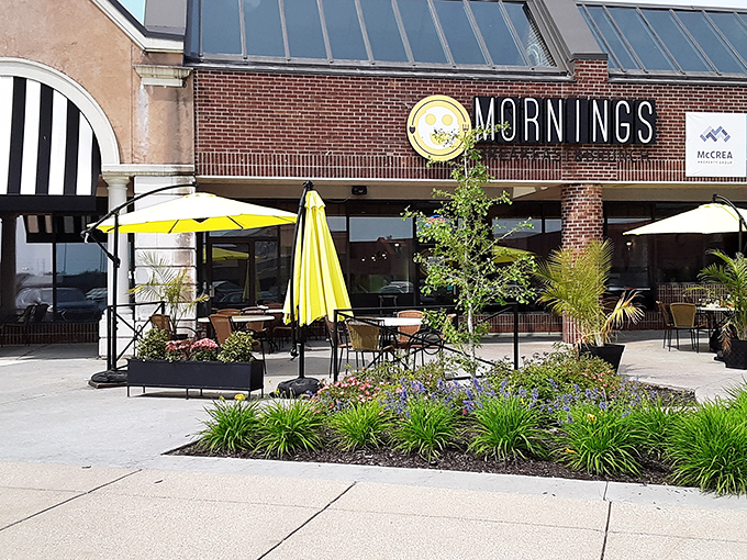 The cheerful yellow smiley face logo seems to know something you don't yet&mdash;that breakfast nirvana awaits behind those brick walls.