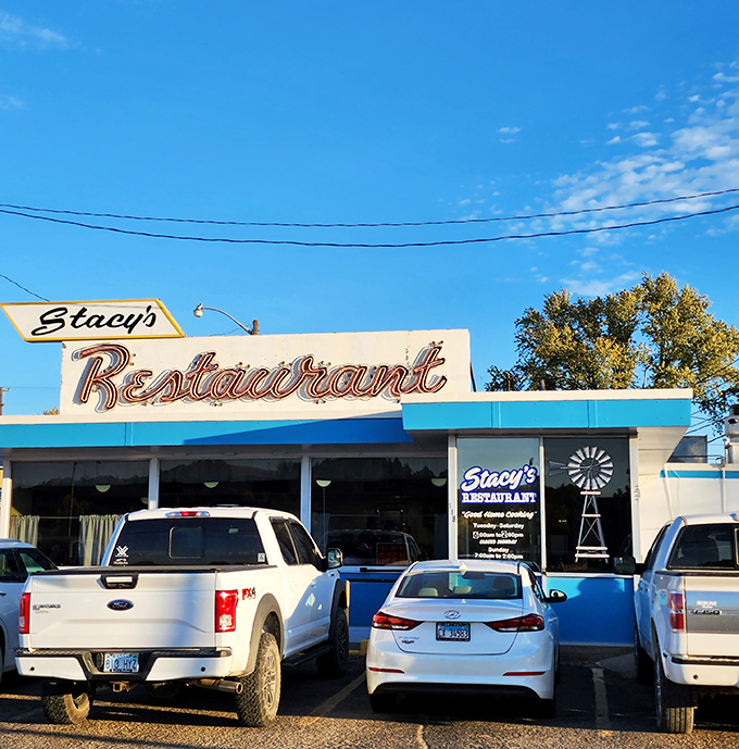 The classic neon sign beckons like an old friend. Stacy's Restaurant stands proudly against the Kansas sky, promising comfort and nostalgia with every meal.