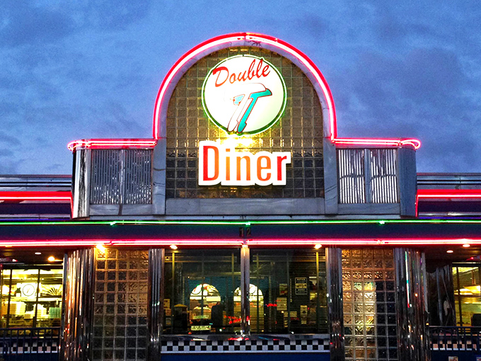 The retro facade of Double T Diner glows like a beacon for hungry travelers. Classic glass blocks and chrome trim scream "authentic American diner experience."