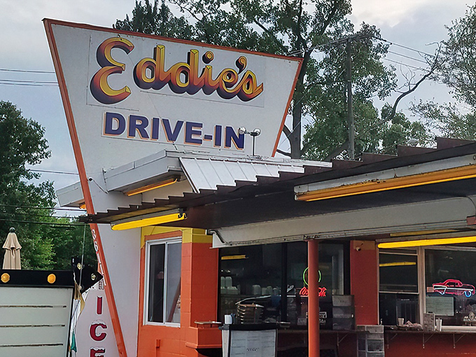 Eddie's iconic orange exterior isn't just a building&mdash;it's a time machine disguised as a drive-in, beckoning hungry travelers with its retro charm and promise of burger bliss.