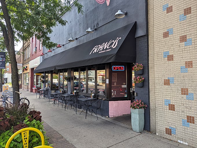 Francis Burger Joint's sleek black exterior beckons hungry passersby with its minimalist charm and promise of burger perfection ahead.