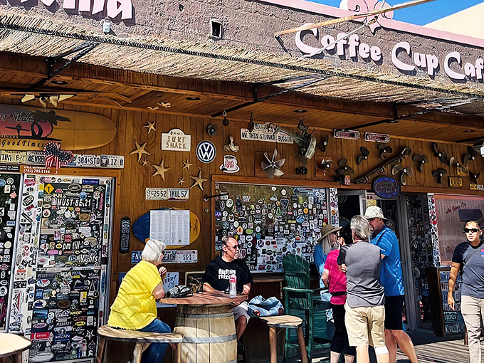Sticker heaven meets breakfast paradise. The Coffee Cup Cafe's exterior is a visual feast of memorabilia that promises the culinary adventure waiting inside.