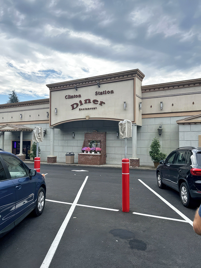 The Clinton Station Diner stands proudly against the New Jersey sky, its classic facade promising comfort food treasures within. No ordinary roadside stop, this is a destination.