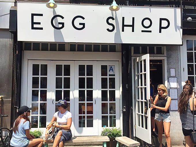 The minimalist white storefront of Egg Shop beckons like a breakfast beacon on Elizabeth Street, promising eggy delights within those French doors.