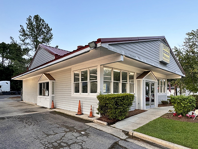 The modest white exterior with its simple sign says everything you need to know: no gimmicks, just honest Southern cooking that keeps locals coming back.