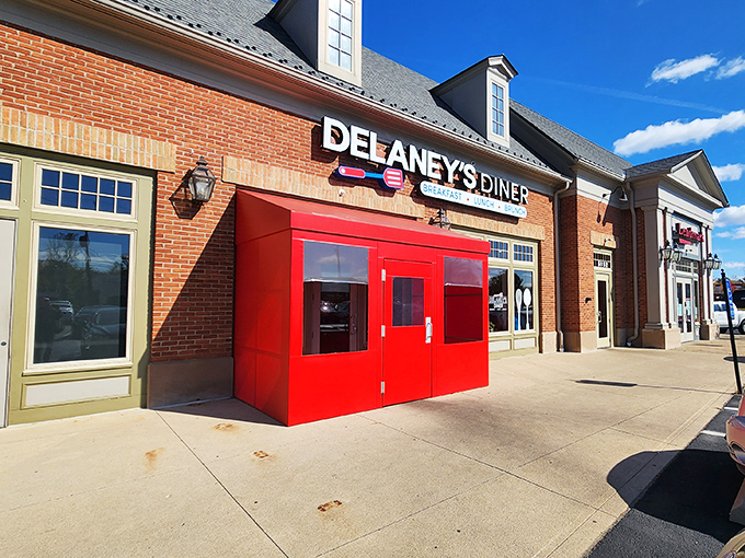 The brick exterior with those eye-catching red doors practically screams "good food inside!" Delaney's Diner stands out without trying too hard.