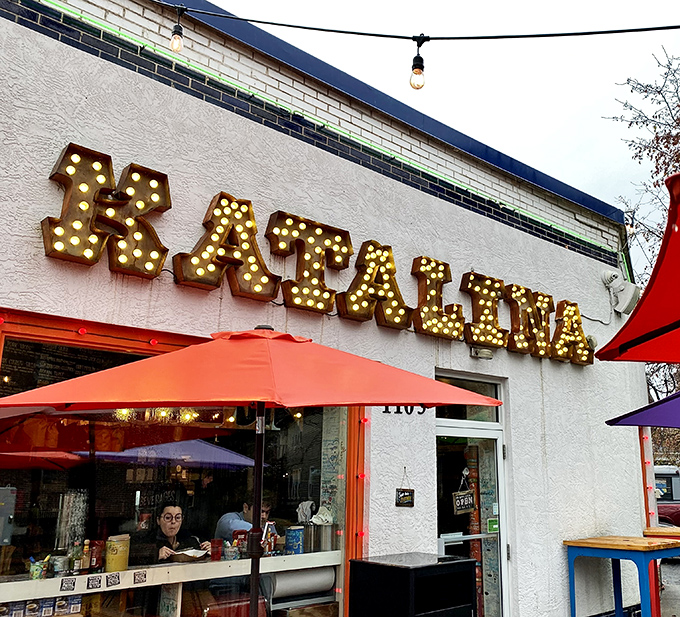 The marquee-style sign beckons like a carnival of culinary delights, promising pancake balls that are worth every minute of the inevitable wait.