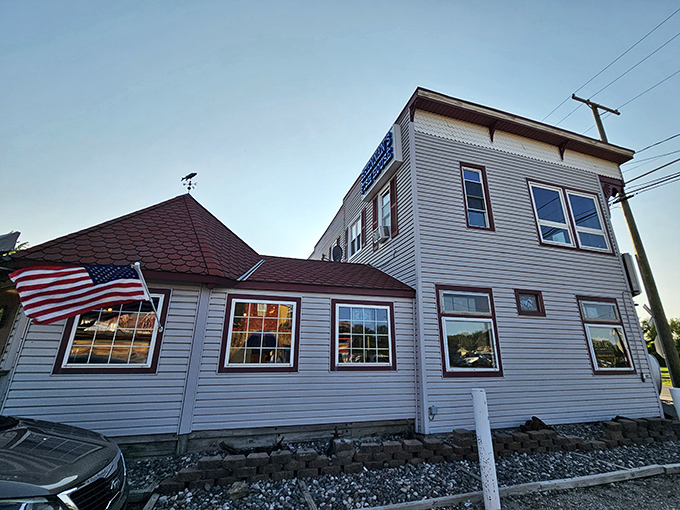 The unassuming white clapboard exterior of Brennan's Fish House stands like a maritime mirage in landlocked Ohio, complete with that charming red-roofed turret.
