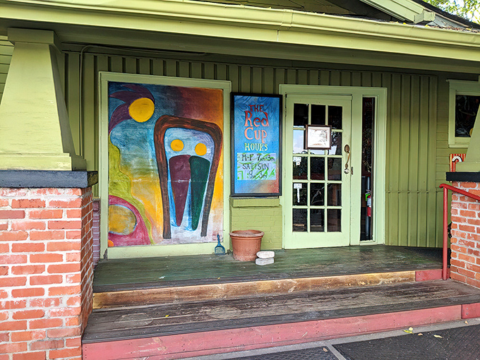 The mint-green craftsman house stands like a cheerful beacon of breakfast hope, promising plant-based delights inside its historic walls.