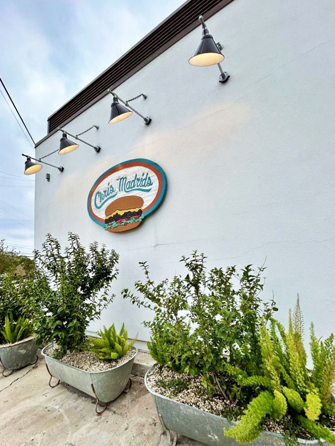 The corner of Blanco and Hollywood marks the spot where burger dreams come true at Chris Madrid's iconic white building.