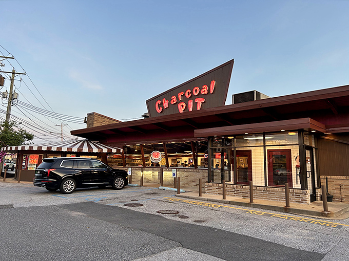 The mid-century charm of Charcoal Pit stands proudly on Concord Pike, its distinctive angular roof beckoning burger lovers like a meaty lighthouse on Delaware's culinary shore.