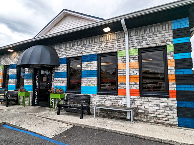 The colorful exterior of Early Bird Diner stands out like a beach umbrella in winter, promising a dining experience as vibrant as its paint job.