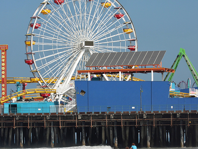 The ultimate California dream: a vibrant amusement park perched over the Pacific Ocean, where cotton candy dreams and salty breezes create perfect seaside memories.