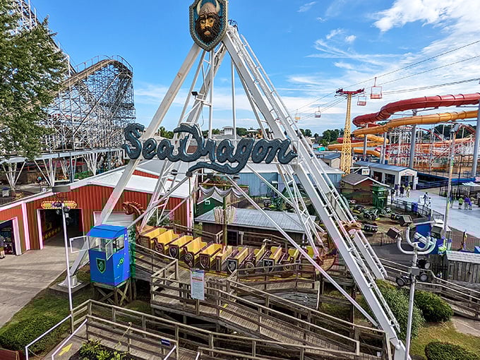 The Sea Dragon swings riders into nostalgic thrills against the backdrop of wooden coasters and water slides at Indiana Beach.